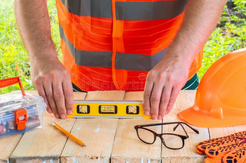 The Master Builder Levels the Surface of the Boards with a Building ...
