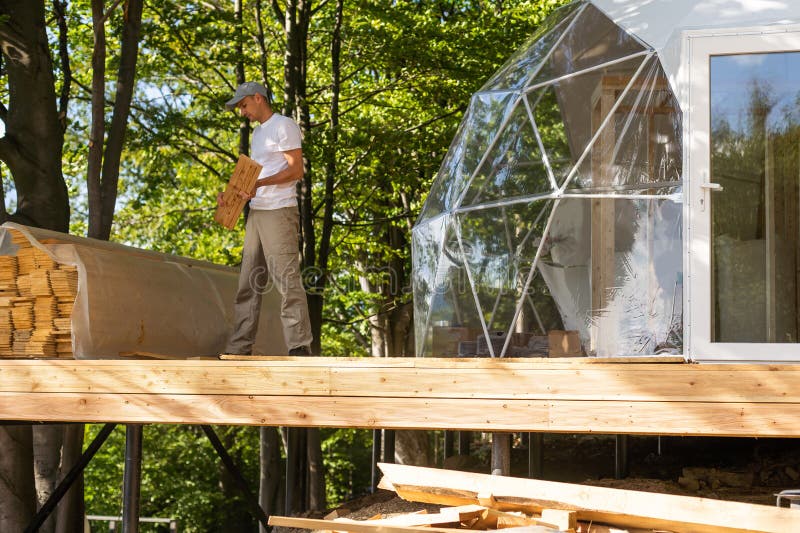 The Master Builds the Dome. Outside Spherical Glamping Dome ...