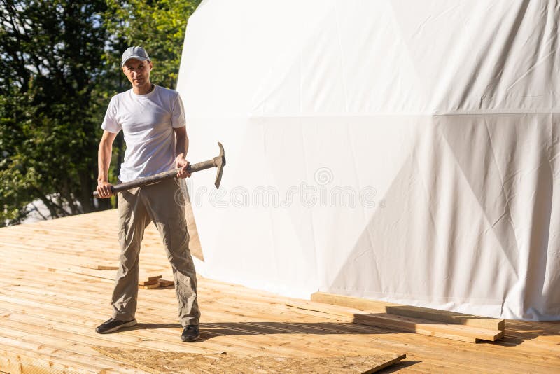 The Master Builds the Dome. Outside Spherical Glamping Dome ...