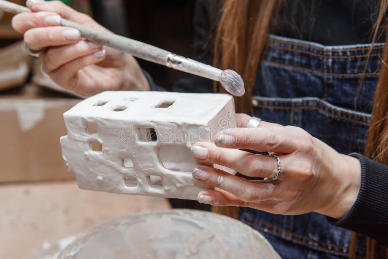 A Master Ceramist Holds a Clay Product in His Hands. Making a Ceramic ...