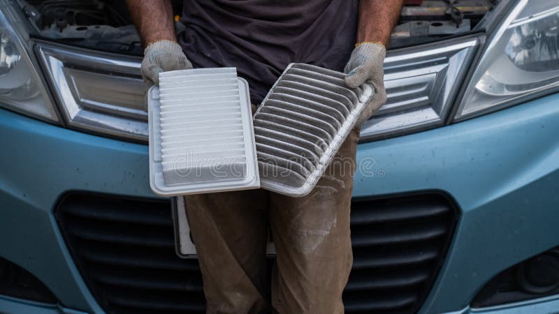The Master Changes the Air Filter in the Car Engine. Stock Image ...
