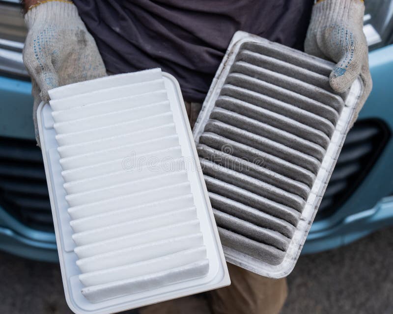 The Master Changes the Air Filter in the Car Engine. Stock Image ...
