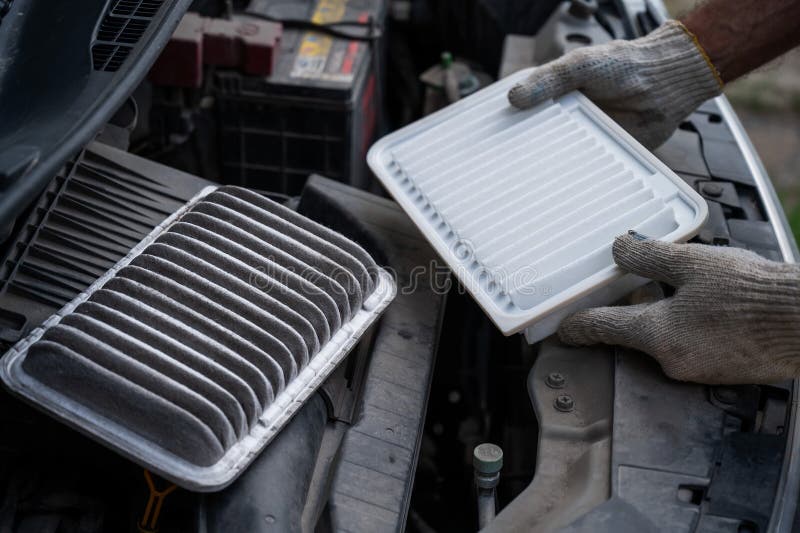 The Master Changes the Air Filter in the Car Engine. Stock Image ...