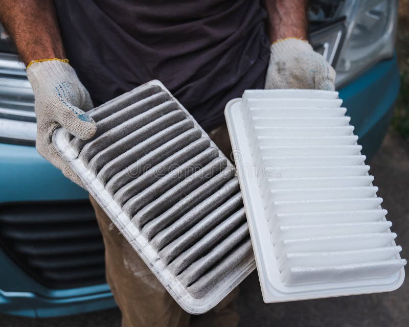 The Master Changes the Air Filter in the Car Engine. Stock Image ...