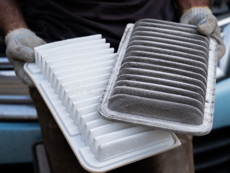 The Master Changes the Air Filter in the Car Engine. Stock Image ...