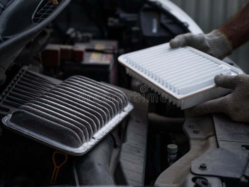 The Master Changes the Air Filter in the Car Engine. Stock Image ...