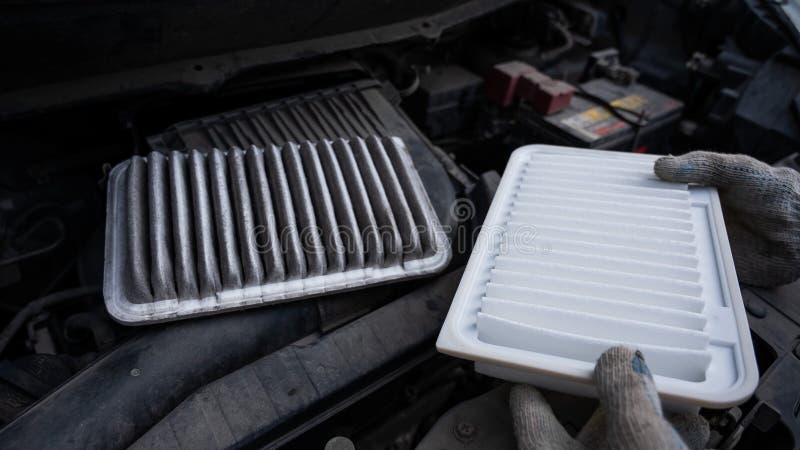 The Master Changes the Air Filter in the Car Engine. Stock Image ...