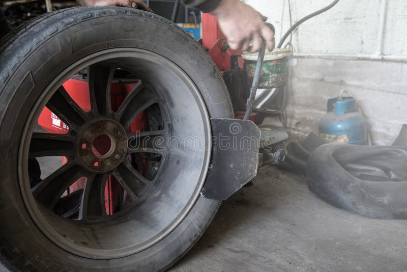 The Master Changes the Wheel Stock Photo - Image of wheel, auto: 220827774