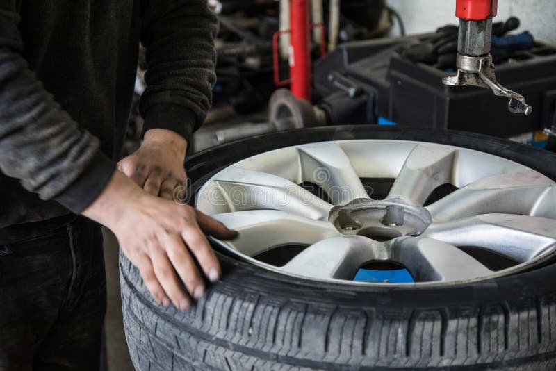 The Master Changes the Wheel Stock Photo - Image of adult, workshop ...