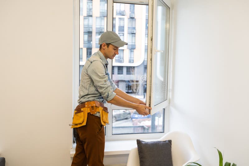 Master Changing a Double-glazed Window in a Plastic Window, Side View ...