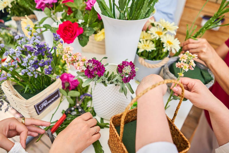 Master Class on Making Bouquets. Spring Bouquet in Wicker Basket Stock ...