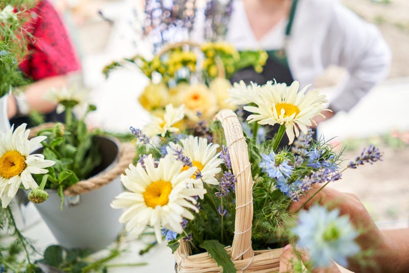 Master Class on Making Bouquets. Spring Bouquet in Wicker Basket Stock ...