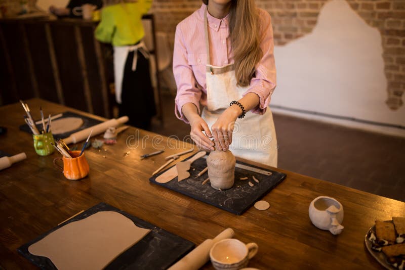 A Master Class in Modeling a Clay Jug. the Girl is Engaged in Modeling ...