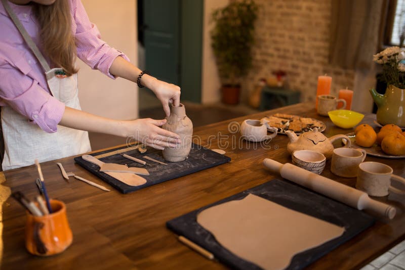 A Master Class in Modeling a Clay Jug. the Girl is Engaged in Modeling ...