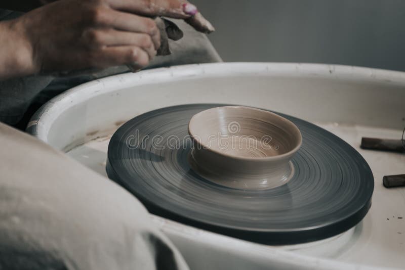 Work in a Pottery Workshop. Close-up of Hands and Potter`s Wheel Stock ...