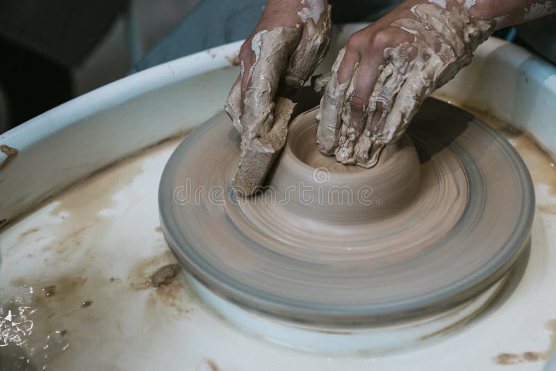 Work in a Pottery Workshop. Close-up of Hands and Potter`s Wheel Stock ...