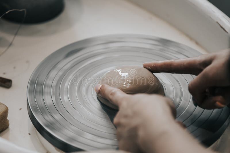 Work in a Pottery Workshop. Close-up of Hands and Potter`s Wheel Stock ...