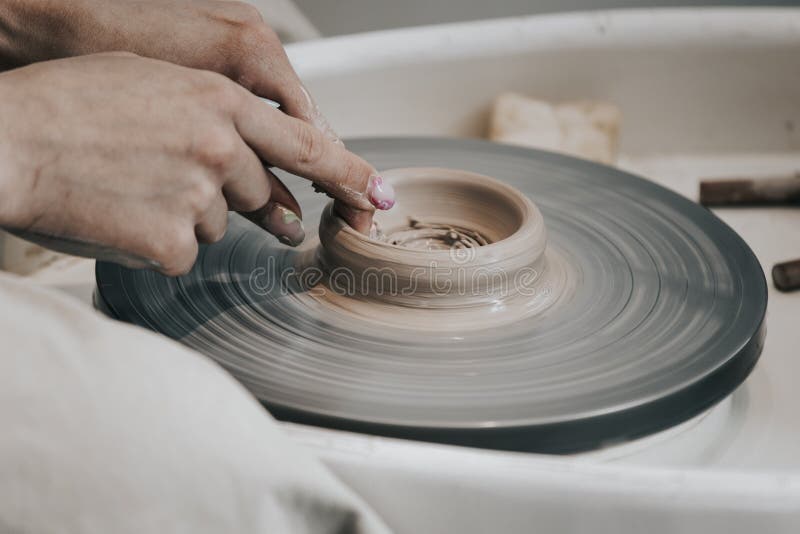 Work in a Pottery Workshop. Close-up of Hands and Potter`s Wheel Stock ...