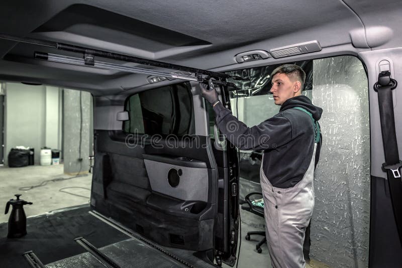 The Master Cleans and Adjusts the Interior of the Car at the Service ...