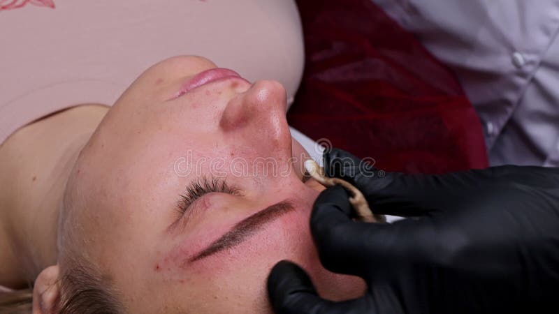 Master Cleans Eyebrows after Permanent Makeup Procedure Eyebrow Tattoo ...