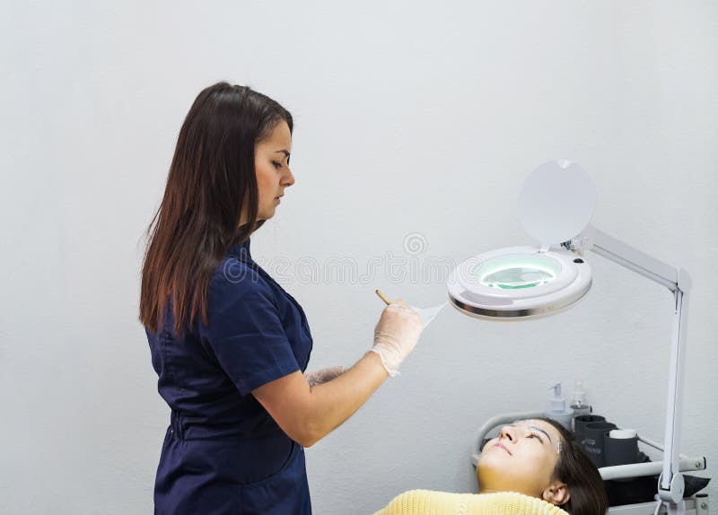 Master and Client in the Salon during the Permanent Eyebrow Makeup ...