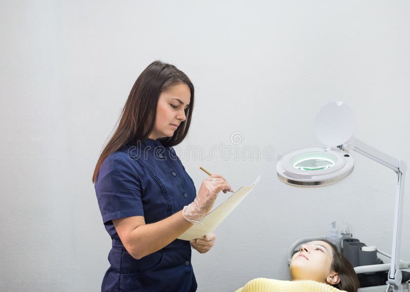 Master and Client in the Salon during the Permanent Eyebrow Makeup ...
