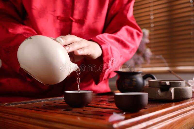 Master Conducting Traditional Tea Ceremony at Table, Closeup Stock ...