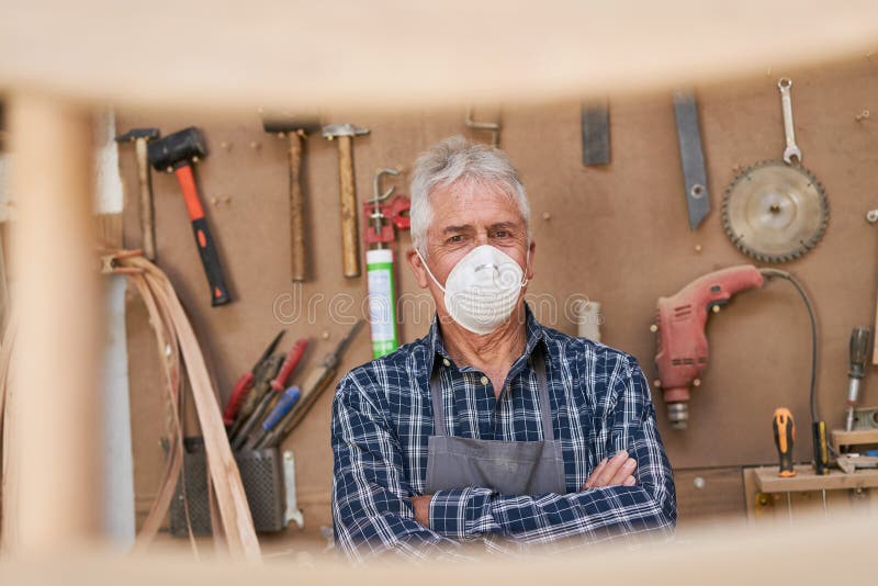 Craftsman Master with Mask because of Covid-19 Stock Photo - Image of ...