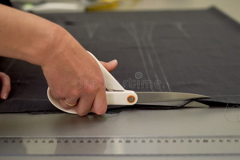 Master Cuts Fabric. Nesting. Suiting Fabric Marked with White Chalk ...