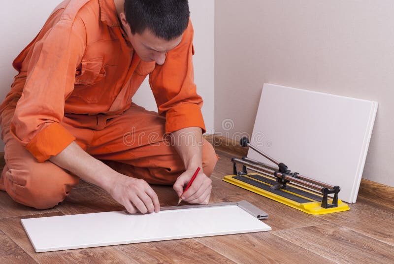 Master cuts the tile stock image. Image of bathroom, cutting - 88230767