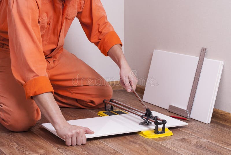 Master cuts the tile stock photo. Image of professional - 88230838