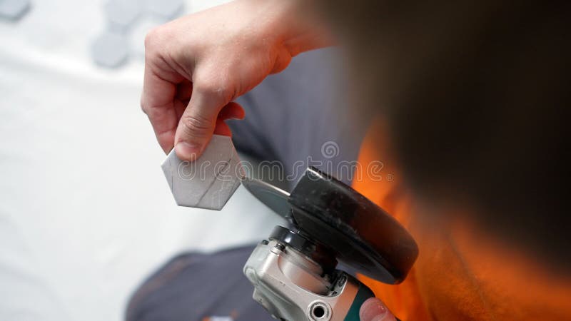 A Tiler Cuts Tiles for Laying on the Floor. the Master Skillfully ...
