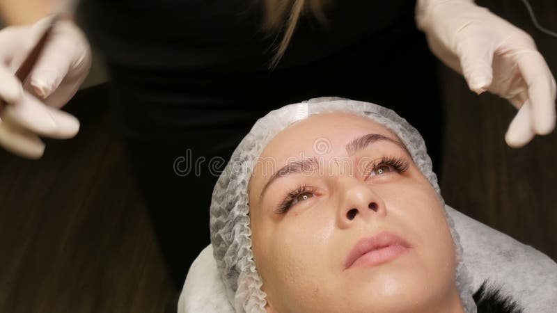 The Master Applies Special Anesthesia before the Procedure. Eyebrow ...