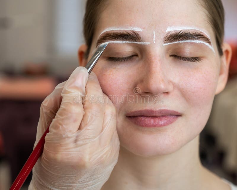 The Master Draws the Shape of the Eyebrows with White Paint before ...