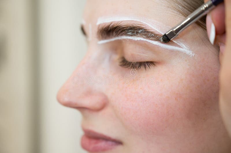 The Master Draws the Shape of the Eyebrows with White Paint before ...