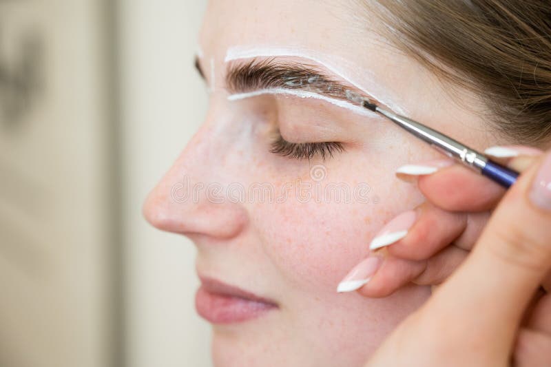 The Master Draws the Shape of the Eyebrows with White Paint before ...