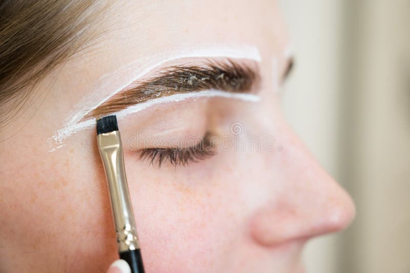 The Master Draws the Shape of the Eyebrows with White Paint before ...