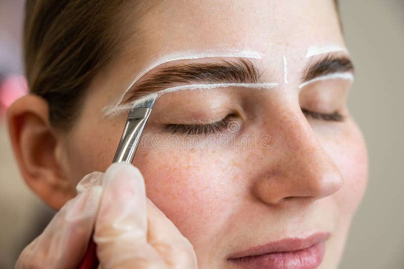 The Master Draws the Shape of the Eyebrows with White Paint before ...