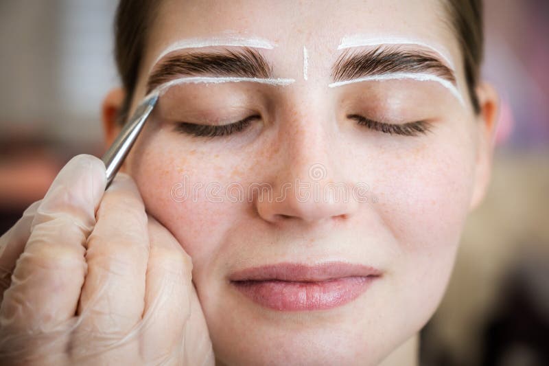 The Master Draws the Shape of the Eyebrows with White Paint before ...