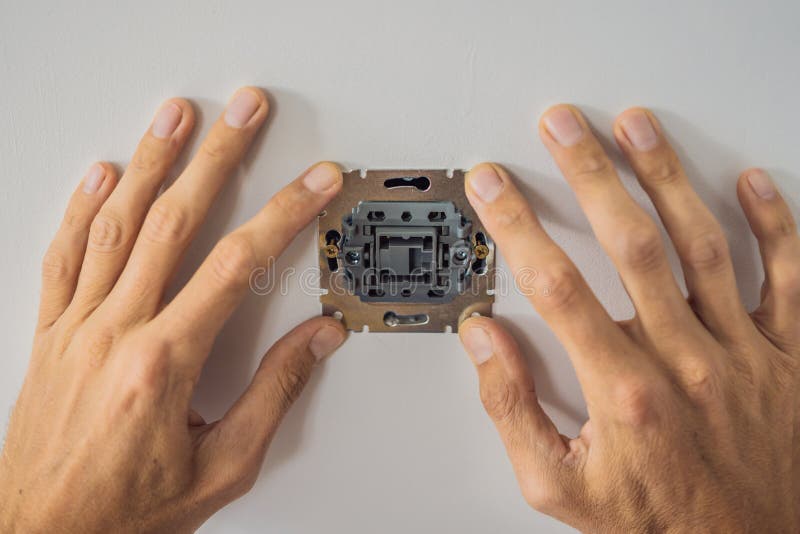 Master Electrician Installs a Socket in the House Stock Photo - Image ...