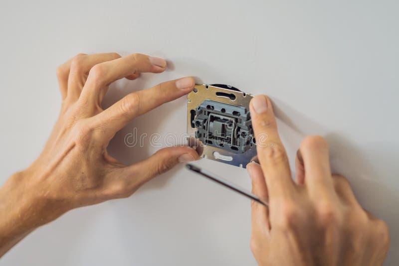 Master Electrician Installs a Socket in the House Stock Image - Image ...