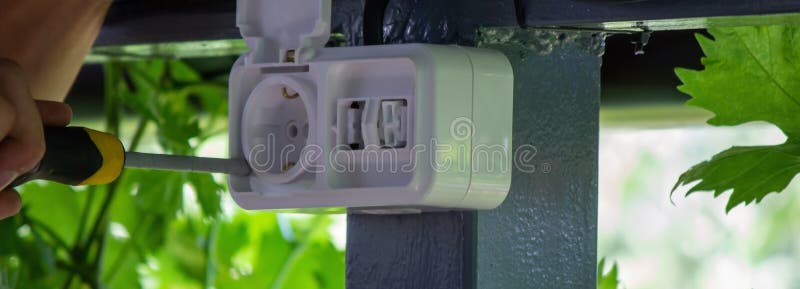 A Master Electrician Installs a Socket and a Switch Stock Image - Image ...