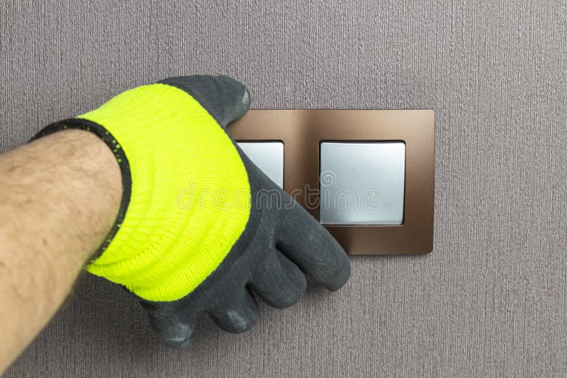 The Master Electrician Sets the Switch. Close-up. the Room is Colored ...