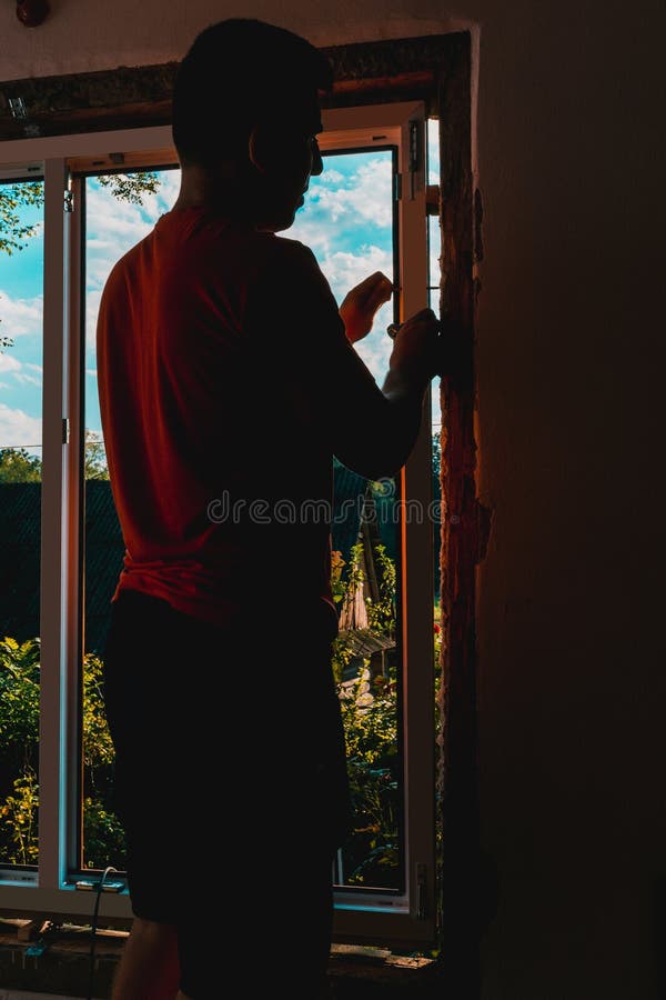 The Master Fixes a Window To a Wall by Means of a Manual Key ...