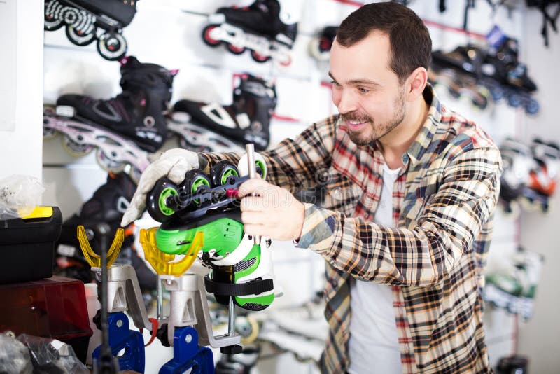 Master Fixing Roller-skates Stock Photo - Image of quality, master ...