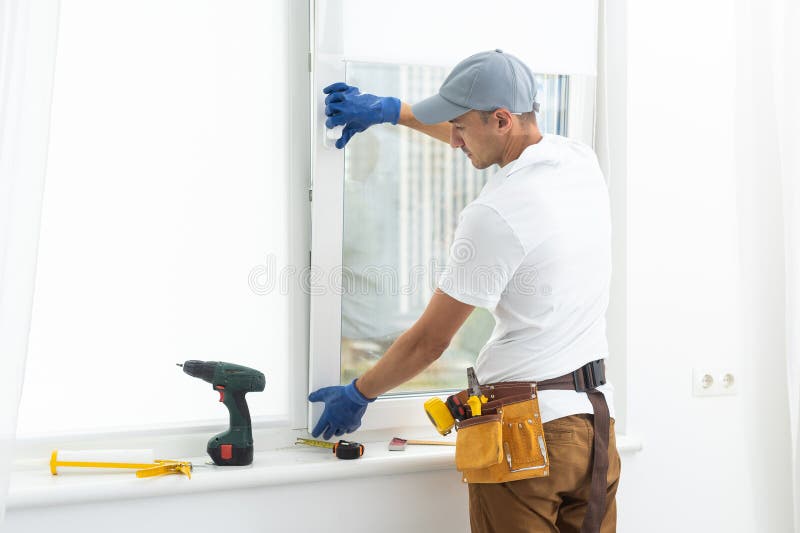Master in Gloves Adjusting Pvc Windows with Screwdriver Closeup ...