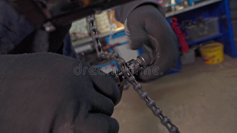 Master Repairs the Bicycle Chain with a Tool. Workshop, Bicycle Repair ...