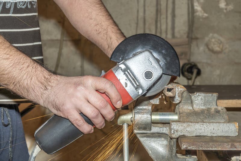 A Master with a Hand Grinder in His Hand Stock Image - Image of angle ...