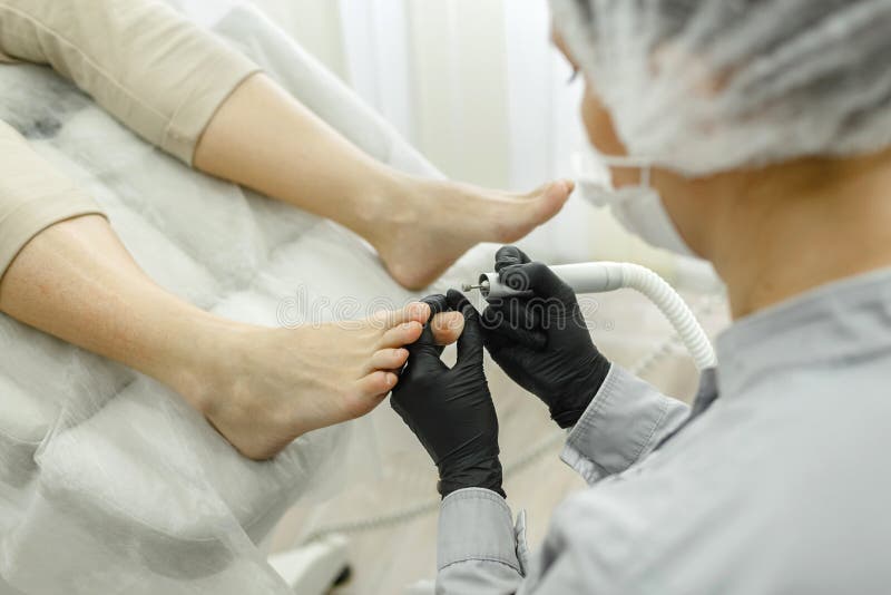 Master Hardware Pedicure during Operation. Nail Processing and Milling ...