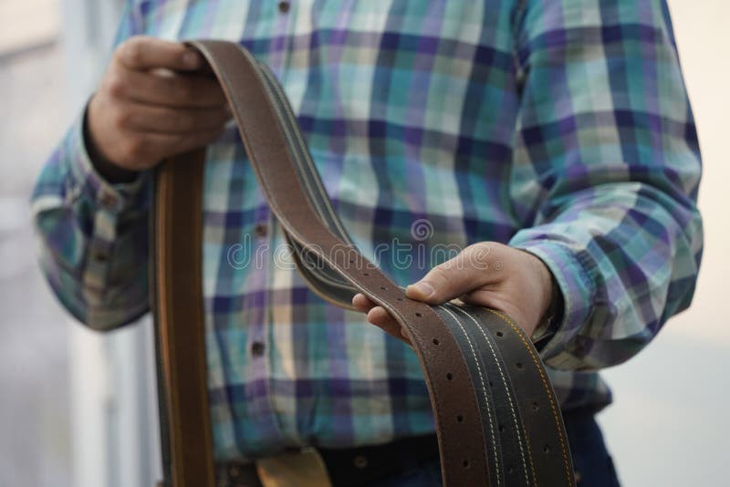The Master Holds Handmade Leather Belts with Buckles in His Hands Stock ...